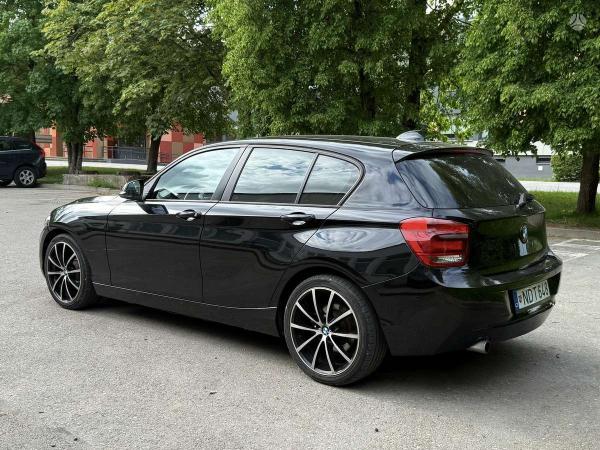 Black BMW 116 2011 in Jonava, with an engine capacity of 2.00 L and mileage of 300 thousand km for 3900 €, photo 4 on AUTOMOTO.COM.LV