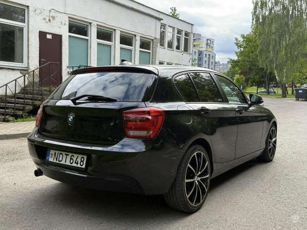 Black BMW 116 2011 in Jonava, with an engine capacity of 2.00 L and mileage of 300 thousand km for 3900 €, photo 5 on AUTOMOTO.COM.LV