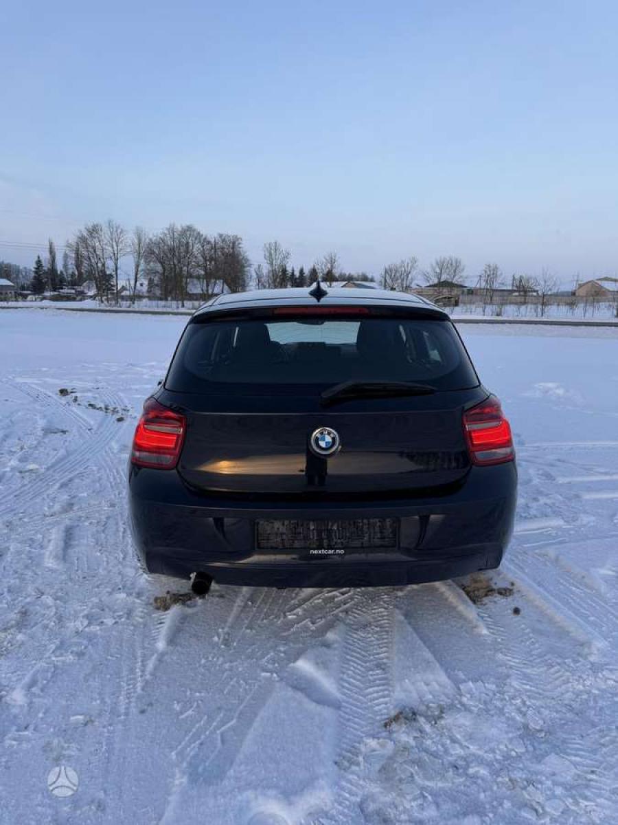 Black BMW 116 2012 in Pasvalys, with an engine capacity of 2.00 L and mileage of 108 thousand km for 7450 €, photo 5 on AUTOMOTO.COM.LV