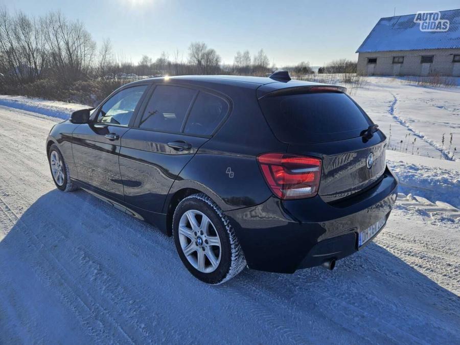 Black BMW 116 2012 in Sakiai, with an engine capacity of 2.00 L and mileage of 211 thousand km for 5200 €, photo 7 on AUTOMOTO.COM.LV