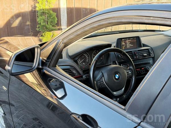 Black BMW 116 2012 in Daugavpils, with an engine capacity of 2.00 L and mileage of 258 thousand km for 8750 €, photo 9 on AUTOMOTO.COM.LV
