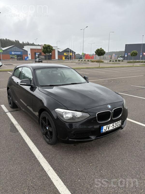 Black BMW 116 2012 in Riga, with an engine capacity of 1.60 L and mileage of 163 thousand km for 4700 €, photo 1 on AUTOMOTO.COM.LV