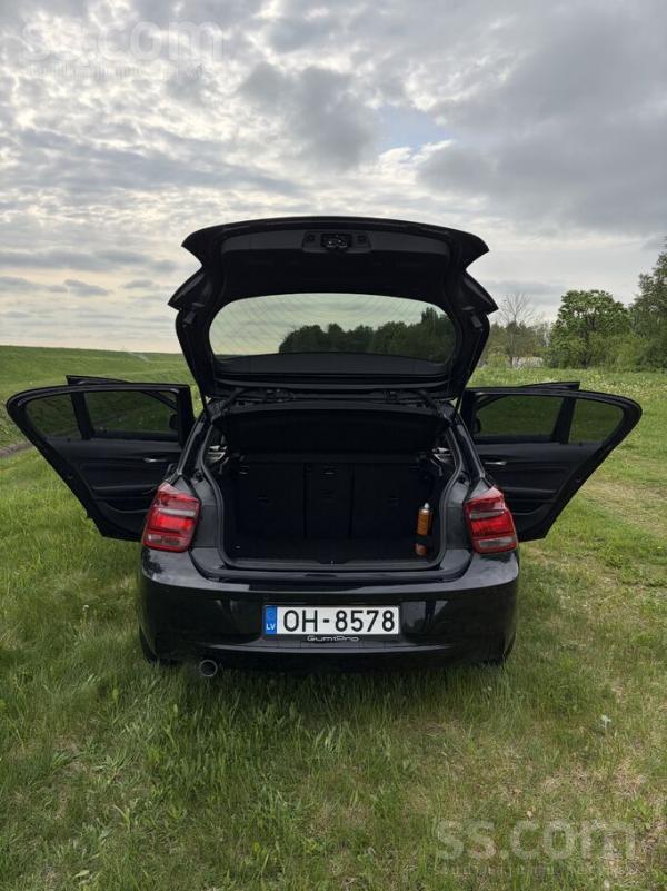 Black BMW 116 2012 in Riga, with an engine capacity of 1.60 L and mileage of 200 thousand km for 5999 €, photo 3 on AUTOMOTO.COM.LV