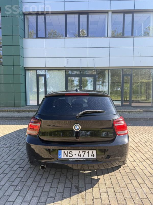 Black BMW 116 2012 in Riga, with an engine capacity of 1.60 L and mileage of 285 thousand km for 6099 €, photo 4 on AUTOMOTO.COM.LV