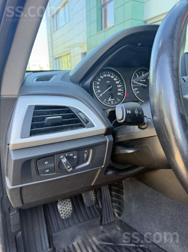 Black BMW 116 2012 in Riga, with an engine capacity of 1.60 L and mileage of 285 thousand km for 6099 €, photo 10 on AUTOMOTO.COM.LV