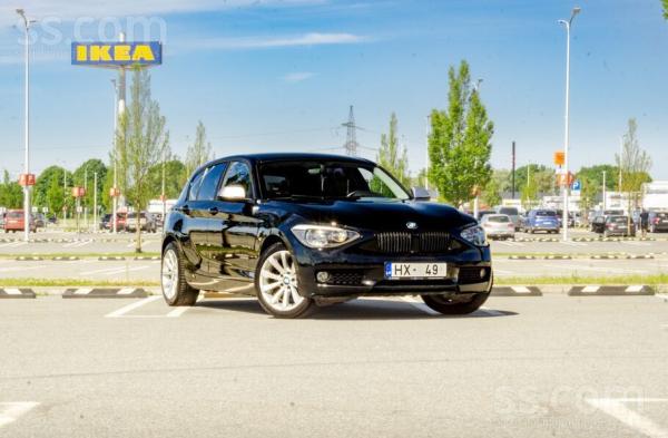 Black BMW 116 2012 in Riga, with an engine capacity of 2.00 L and mileage of 256 thousand km for 6990 €, photo 2 on AUTOMOTO.COM.LV