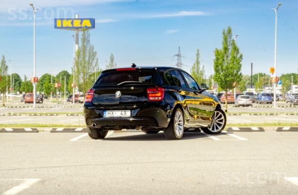 Black BMW 116 2012 in Riga, with an engine capacity of 2.00 L and mileage of 256 thousand km for 6990 €, photo 6 on AUTOMOTO.COM.LV