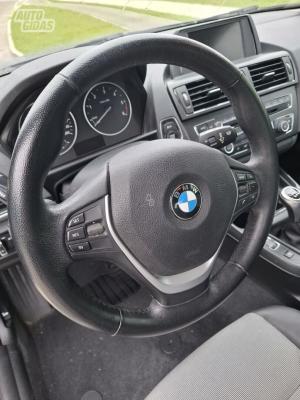 Black BMW 116 2012 in Jonava, with an engine capacity of 2.00 L and mileage of 323 thousand km for 4250 €, photo 14 on AUTOMOTO.COM.LV