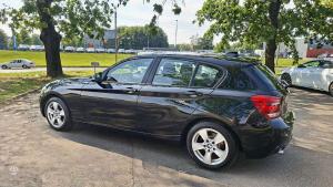 Black BMW 116 2012 in Kaunas, with an engine capacity of 2.00 L and mileage of 211 thousand km for 5200 €, photo 14 on AUTOMOTO.COM.LV