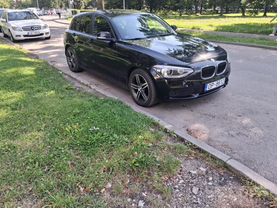 Black BMW 116 2012 in Riga, with an engine capacity of 1.60 L and mileage of 252 thousand km for 5200 €, photo 1 on AUTOMOTO.COM.LV