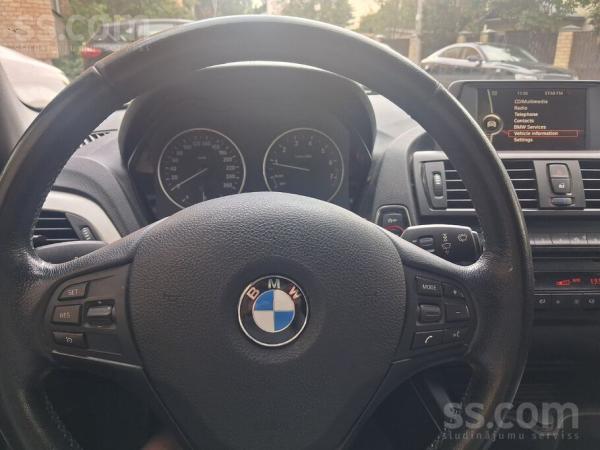 Black BMW 116 2012 in Riga, with an engine capacity of 1.60 L and mileage of 252 thousand km for 5200 €, photo 6 on AUTOMOTO.COM.LV