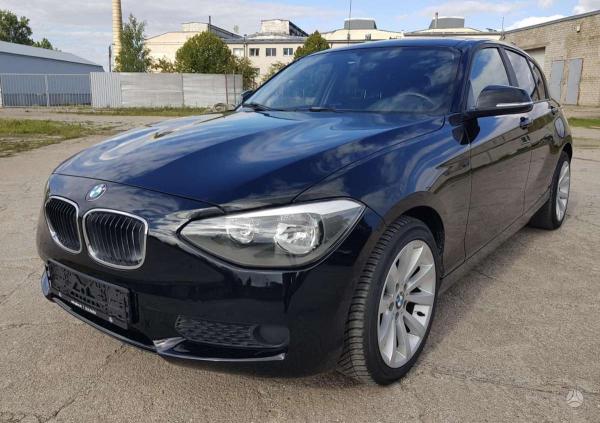 Black BMW 116 2012 in Siauliai, with an engine capacity of 1.60 L and mileage of 229 thousand km for 5200 €, photo 1 on AUTOMOTO.COM.LV