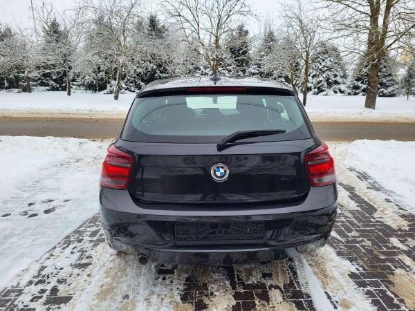 Black BMW 116 2013 in Siauliai, with an engine capacity of 2.00 L and mileage of 214 thousand km for 5450 €, photo 7 on AUTOMOTO.COM.LV