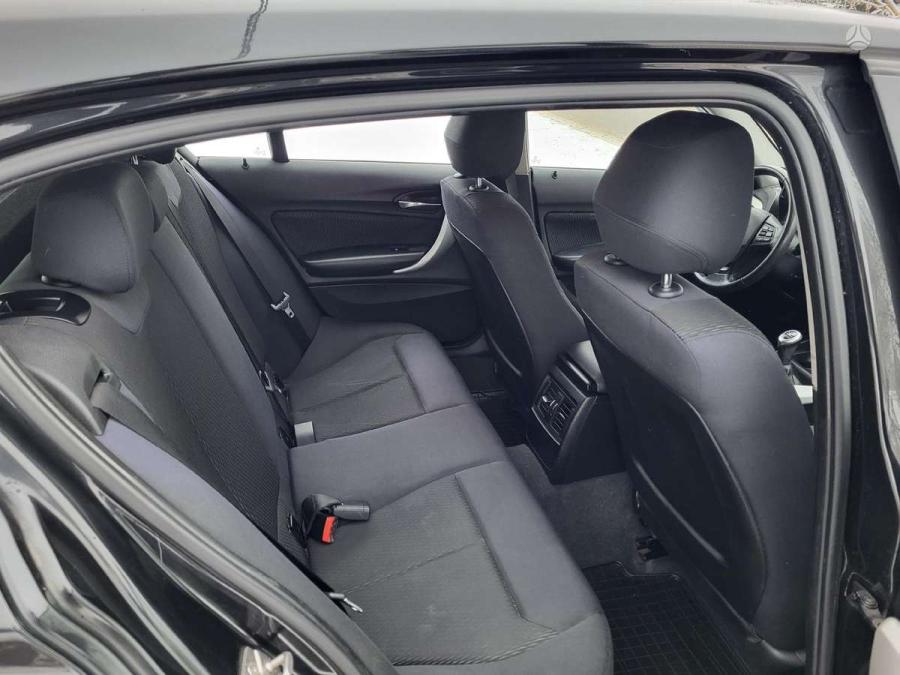 Black BMW 116 2013 in Siauliai, with an engine capacity of 2.00 L and mileage of 214 thousand km for 5450 €, photo 12 on AUTOMOTO.COM.LV