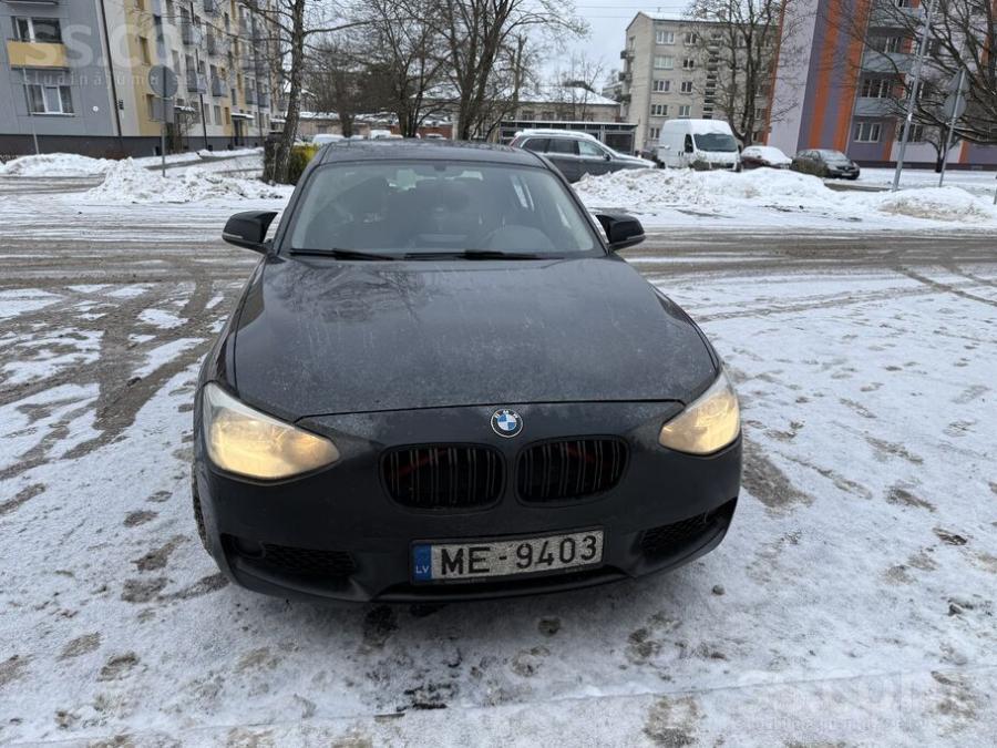 Black BMW 116 2013 in Riga, with an engine capacity of 2.00 L and mileage of 220 thousand km for 4590 €, photo 1 on AUTOMOTO.COM.LV