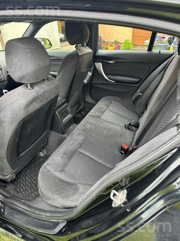 Black BMW 116 2013 in Saldus, with an engine capacity of 1.60 L and mileage of 169 thousand km for 7900 €, photo 7 on AUTOMOTO.COM.LV