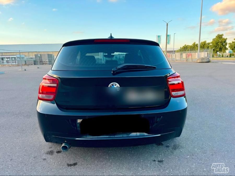 Black BMW 116 2013 in Kaunas, with an engine capacity of 1.60 L and mileage of 195 thousand km for 4199 €, photo 5 on AUTOMOTO.COM.LV