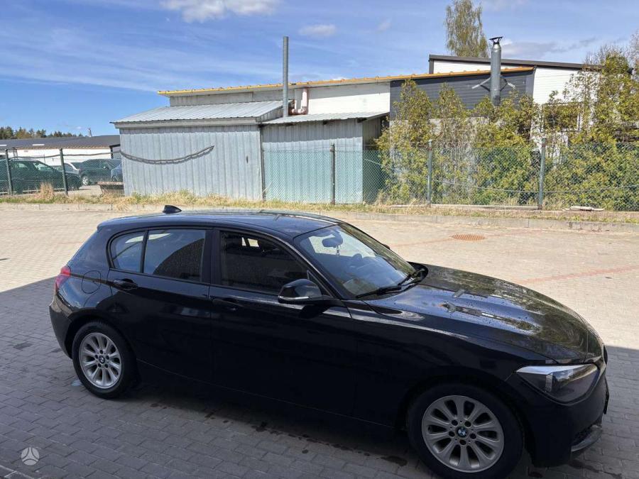 Black BMW 116 2013 in Utena, with an engine capacity of 1.60 L and mileage of 335 thousand km for 4400 €, photo 1 on AUTOMOTO.COM.LV