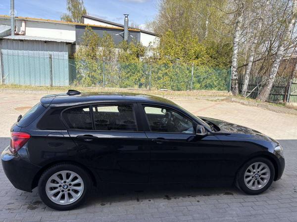 Black BMW 116 2013 in Utena, with an engine capacity of 1.60 L and mileage of 335 thousand km for 4400 €, photo 3 on AUTOMOTO.COM.LV