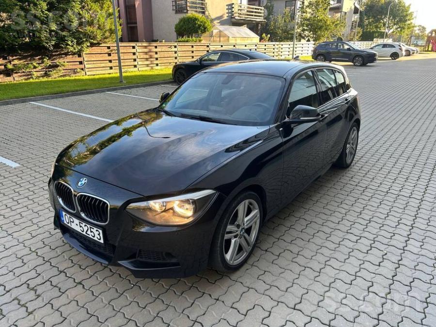 Black BMW 116 2013 in Riga, with an engine capacity of 1.60 L and mileage of 185 thousand km for 6100 €, photo 1 on AUTOMOTO.COM.LV