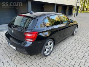 Black BMW 116 2013 in Riga, with an engine capacity of 1.60 L and mileage of 185 thousand km for 6100 €, photo 4 on AUTOMOTO.COM.LV