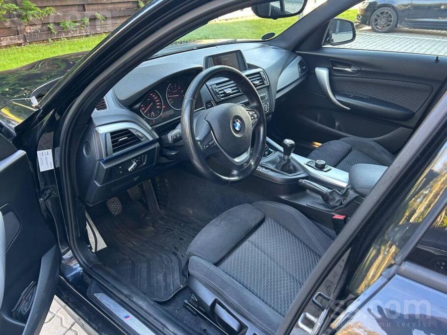 Black BMW 116 2013 in Riga, with an engine capacity of 1.60 L and mileage of 185 thousand km for 6100 €, photo 10 on AUTOMOTO.COM.LV