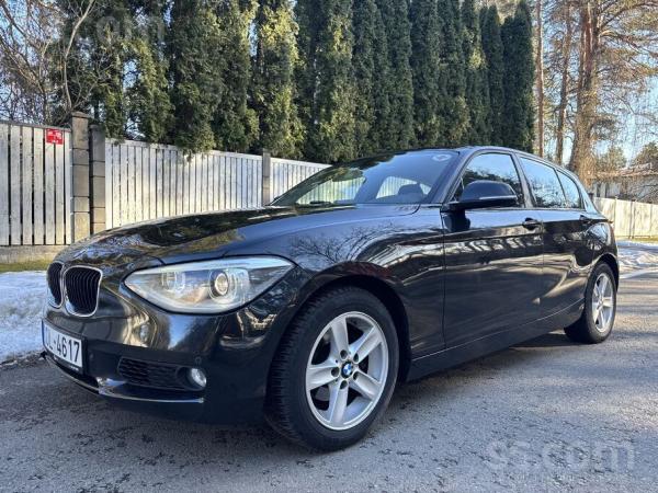 Black BMW 116 2014 in Riga, with an engine capacity of 1.60 L and mileage of 337 thousand km for 4990 €, photo 1 on AUTOMOTO.COM.LV