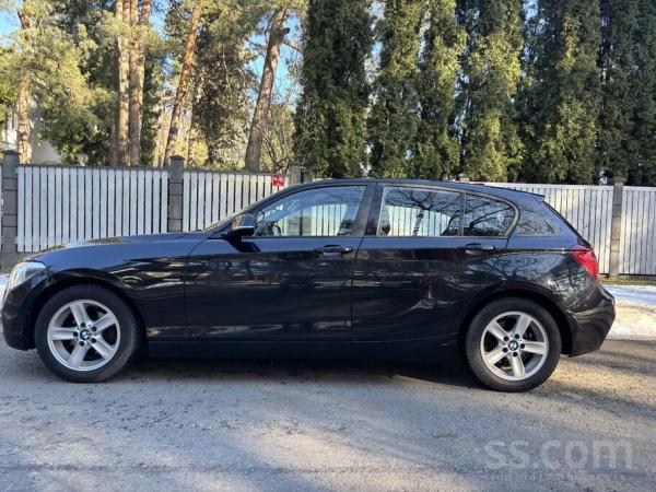 Black BMW 116 2014 in Riga, with an engine capacity of 1.60 L and mileage of 337 thousand km for 4990 €, photo 3 on AUTOMOTO.COM.LV