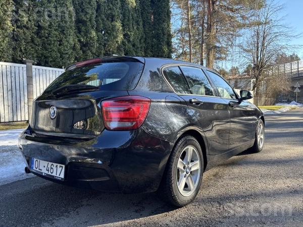 Black BMW 116 2014 in Riga, with an engine capacity of 1.60 L and mileage of 337 thousand km for 4990 €, photo 6 on AUTOMOTO.COM.LV