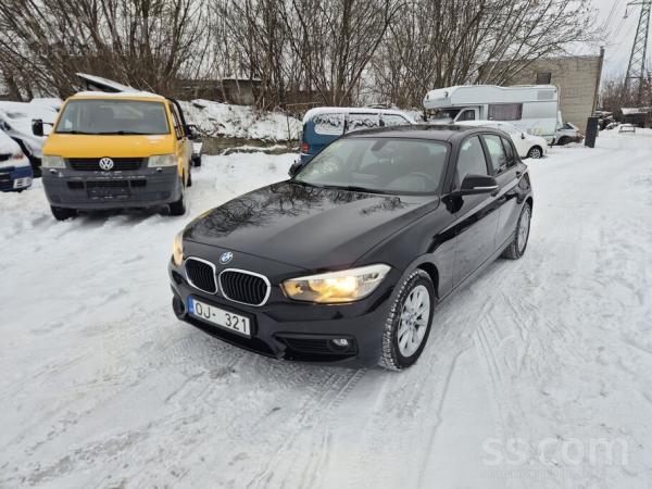 Black BMW 116 2015 in Riga, with an engine capacity of 1.50 L and mileage of 232 thousand km for 8990 €, photo 1 on AUTOMOTO.COM.LV