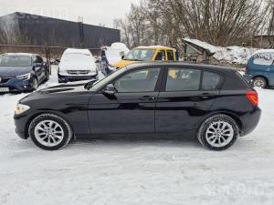 Black BMW 116 2015 in Riga, with an engine capacity of 1.50 L and mileage of 232 thousand km for 8990 €, photo 8 on AUTOMOTO.COM.LV