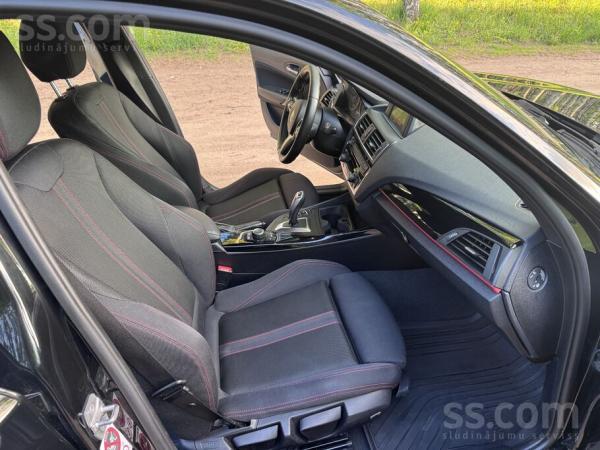 Black BMW 116 2015 in Riga, with an engine capacity of 1.60 L and mileage of 209 thousand km for 11550 €, photo 8 on AUTOMOTO.COM.LV