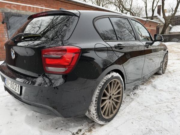 Black BMW 116 2011 in Liepaja, with an engine capacity of 2.00 L and mileage of 249 thousand km for 5300 €, photo 1 on AUTOMOTO.COM.LV