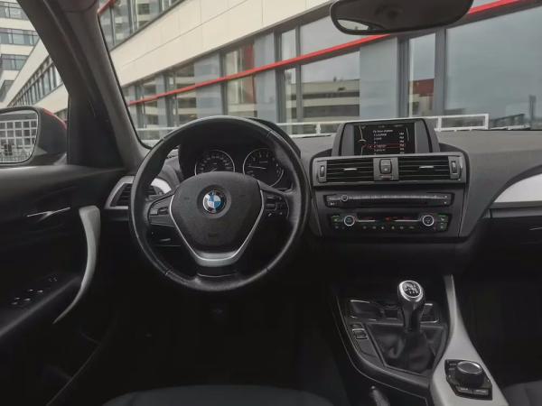 Red BMW 116 2012 in Riga, with an engine capacity of 1.60 L and mileage of 163 thousand km for 5990 €, photo 6 on AUTOMOTO.COM.LV