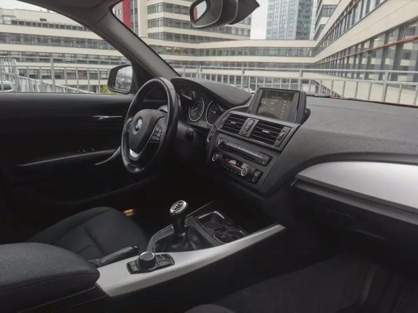 Red BMW 116 2012 in Riga, with an engine capacity of 1.60 L and mileage of 163 thousand km for 5990 €, photo 7 on AUTOMOTO.COM.LV