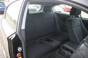 Black BMW 118 2009 in Tukums, with an engine capacity of 2.00 L and mileage of 208 thousand km for 4996 €, photo 14 on AUTOMOTO.COM.LV
