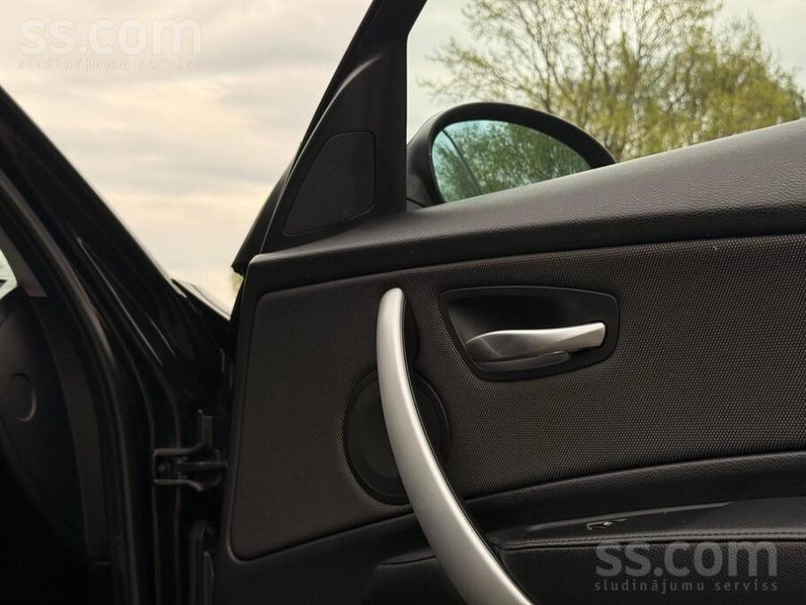 Black BMW 118 2007 in Riga, with an engine capacity of 2.00 L and mileage of 209 thousand km for 3700 €, photo 8 on AUTOMOTO.COM.LV