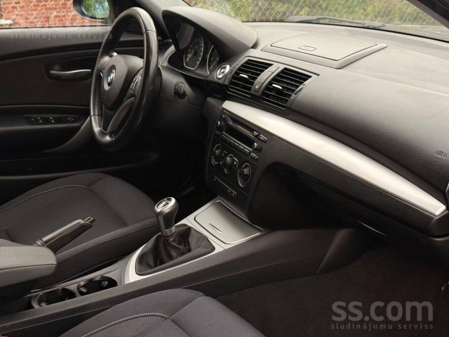 Black BMW 118 2007 in Riga, with an engine capacity of 2.00 L and mileage of 209 thousand km for 3700 €, photo 9 on AUTOMOTO.COM.LV
