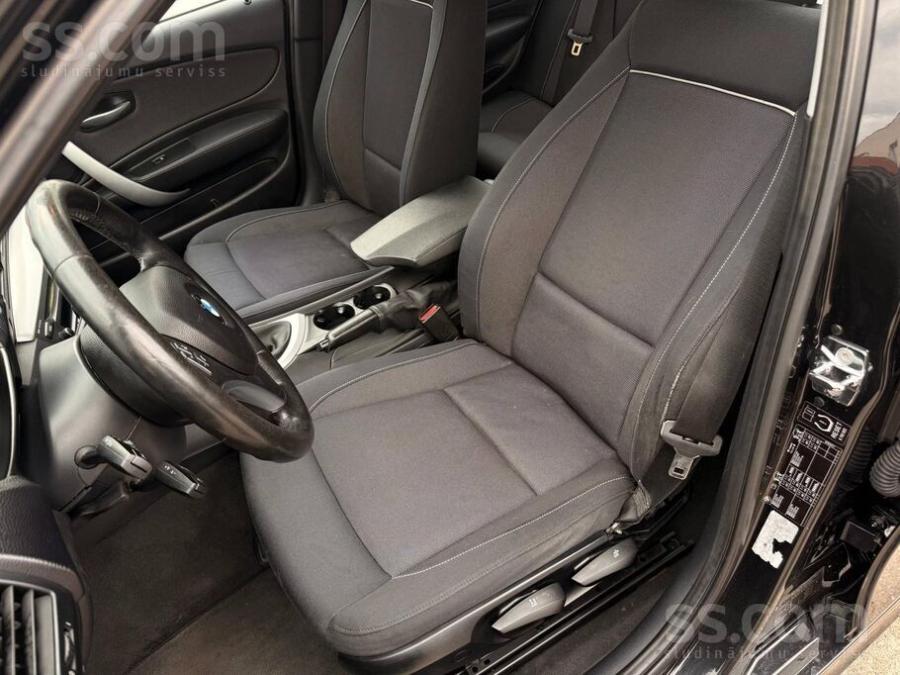 Black BMW 118 2007 in Riga, with an engine capacity of 2.00 L and mileage of 209 thousand km for 3700 €, photo 13 on AUTOMOTO.COM.LV