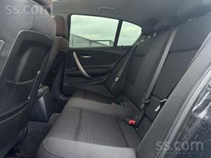 Black BMW 118 2007 in Riga, with an engine capacity of 2.00 L and mileage of 350 thousand km for 2990 €, photo 19 on AUTOMOTO.COM.LV