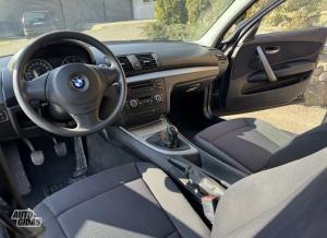 Black BMW 118 2010 in Vilnius, with an engine capacity of 2.00 L and mileage of 298 thousand km for 3850 €, photo 4 on AUTOMOTO.COM.LV