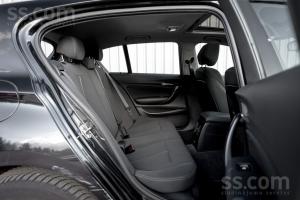 Black BMW 118 2011 in Tukums, with an engine capacity of 2.00 L and mileage of 203 thousand km for 6990 €, photo 11 on AUTOMOTO.COM.LV