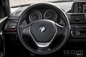 Black BMW 118 2011 in Tukums, with an engine capacity of 2.00 L and mileage of 203 thousand km for 6990 €, photo 16 on AUTOMOTO.COM.LV