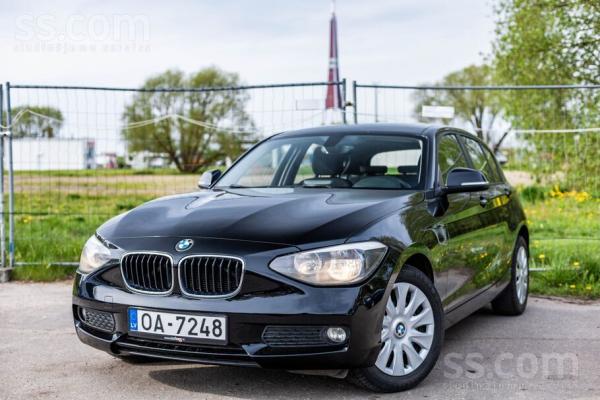 Black BMW 118 2011 in Riga, with an engine capacity of 2.00 L and mileage of 325 thousand km for 6290 €, photo 1 on AUTOMOTO.COM.LV