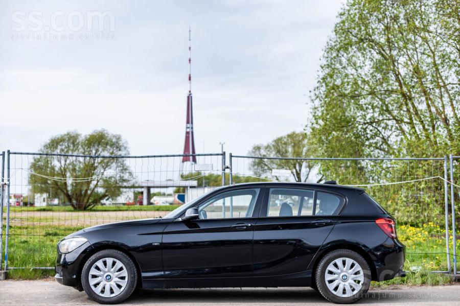Black BMW 118 2011 in Riga, with an engine capacity of 2.00 L and mileage of 325 thousand km for 6290 €, photo 5 on AUTOMOTO.COM.LV