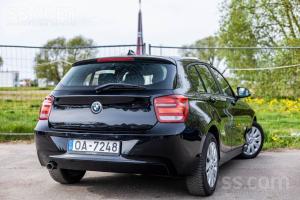 Black BMW 118 2011 in Riga, with an engine capacity of 2.00 L and mileage of 325 thousand km for 6290 €, photo 8 on AUTOMOTO.COM.LV