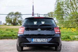 Black BMW 118 2011 in Riga, with an engine capacity of 2.00 L and mileage of 325 thousand km for 6290 €, photo 9 on AUTOMOTO.COM.LV
