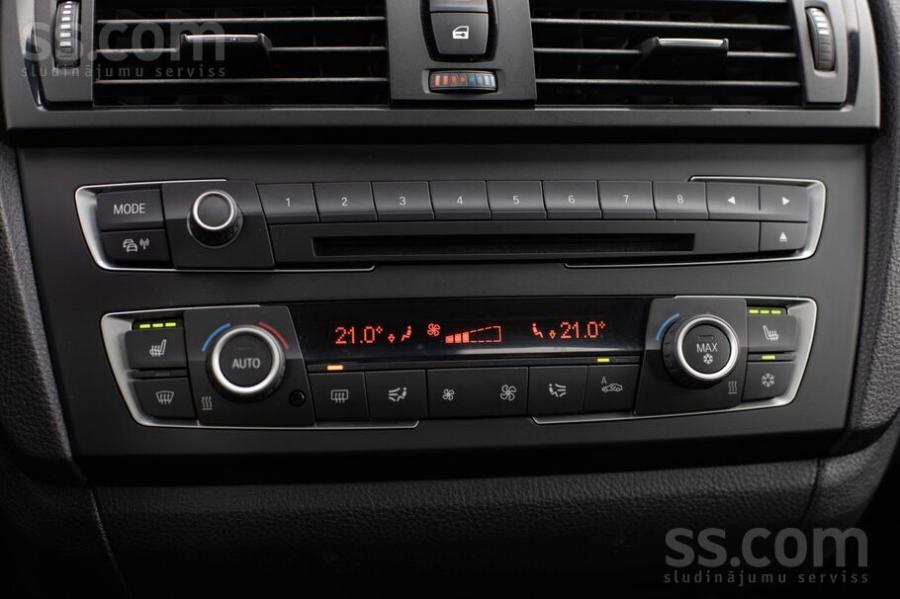 Black BMW 118 2011 in Riga, with an engine capacity of 2.00 L and mileage of 325 thousand km for 6290 €, photo 26 on AUTOMOTO.COM.LV