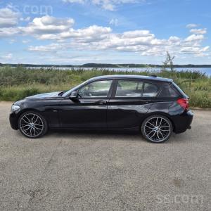 Black BMW 118 2011 in Riga, with an engine capacity of 2.00 L and mileage of 238 thousand km for 5750 €, photo 7 on AUTOMOTO.COM.LV