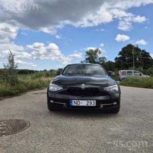 Black BMW 118 2011 in Riga, with an engine capacity of 2.00 L and mileage of 238 thousand km for 5750 €, photo 13 on AUTOMOTO.COM.LV
